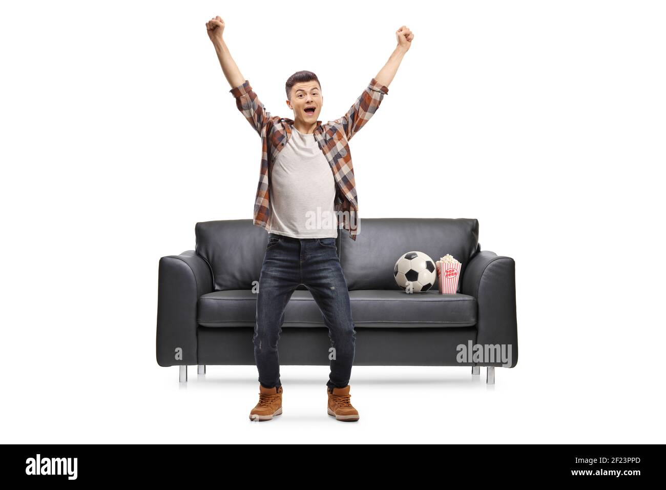 Full length portrait of an excited guy cheering and watching football ...