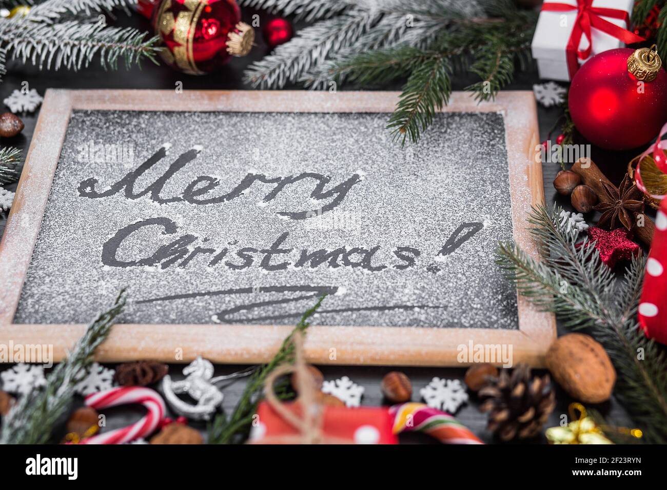 Merry Christmas holiday background - black chalkboard in wooden frame ...