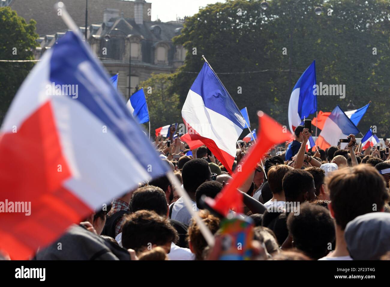 French flags during the parade of the team France on Champ-Elysées ...