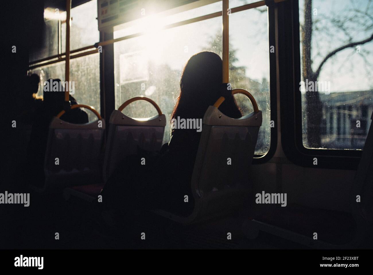 A female sitting in a bus Stock Photo - Alamy