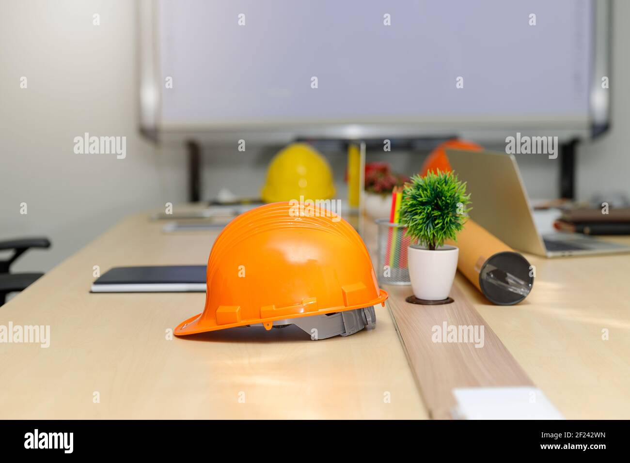 Close up of helmet and etc. on architect desk, architectural concept ...