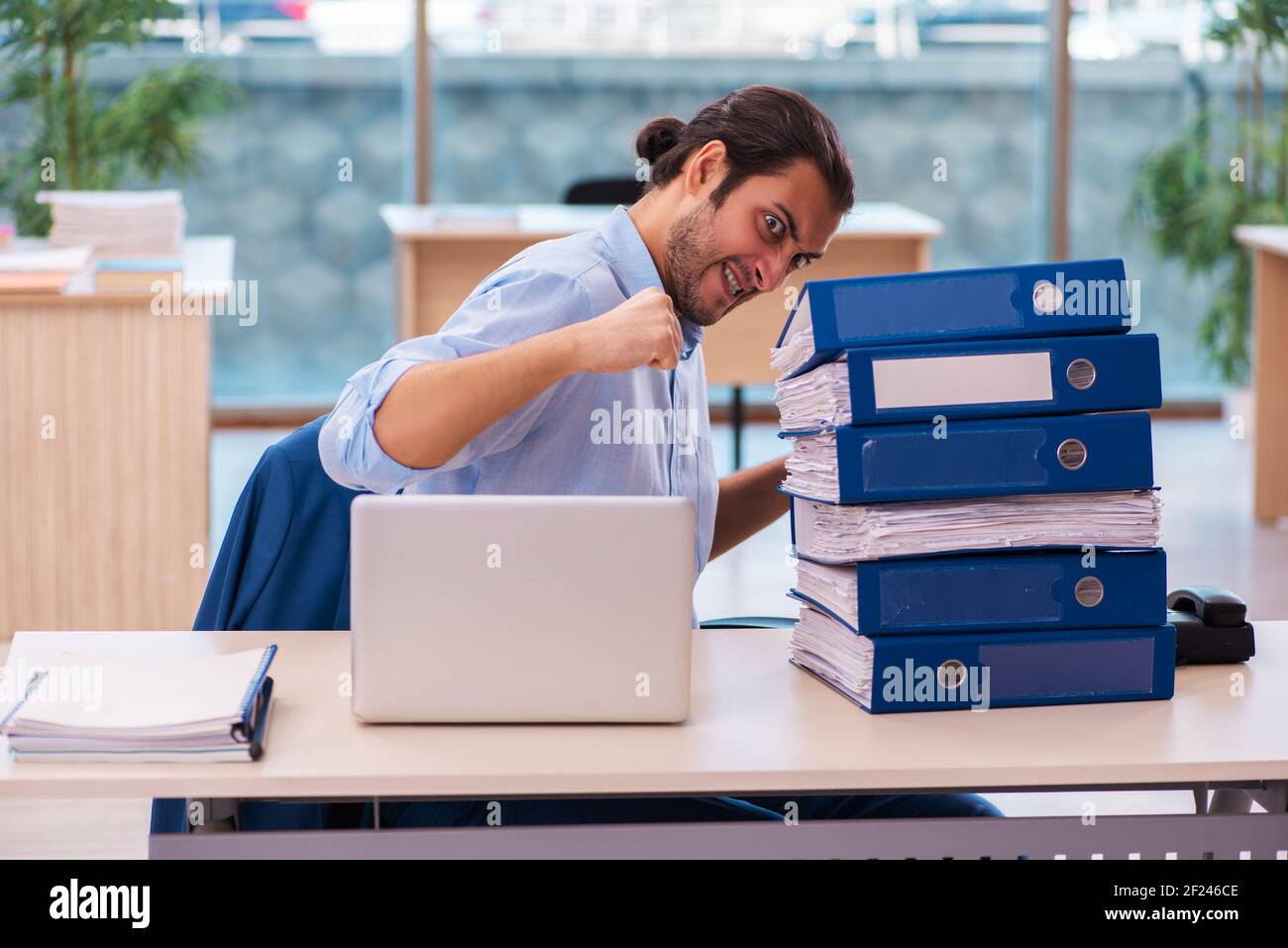Angry male employee destroying hi-res stock photography and images - Alamy