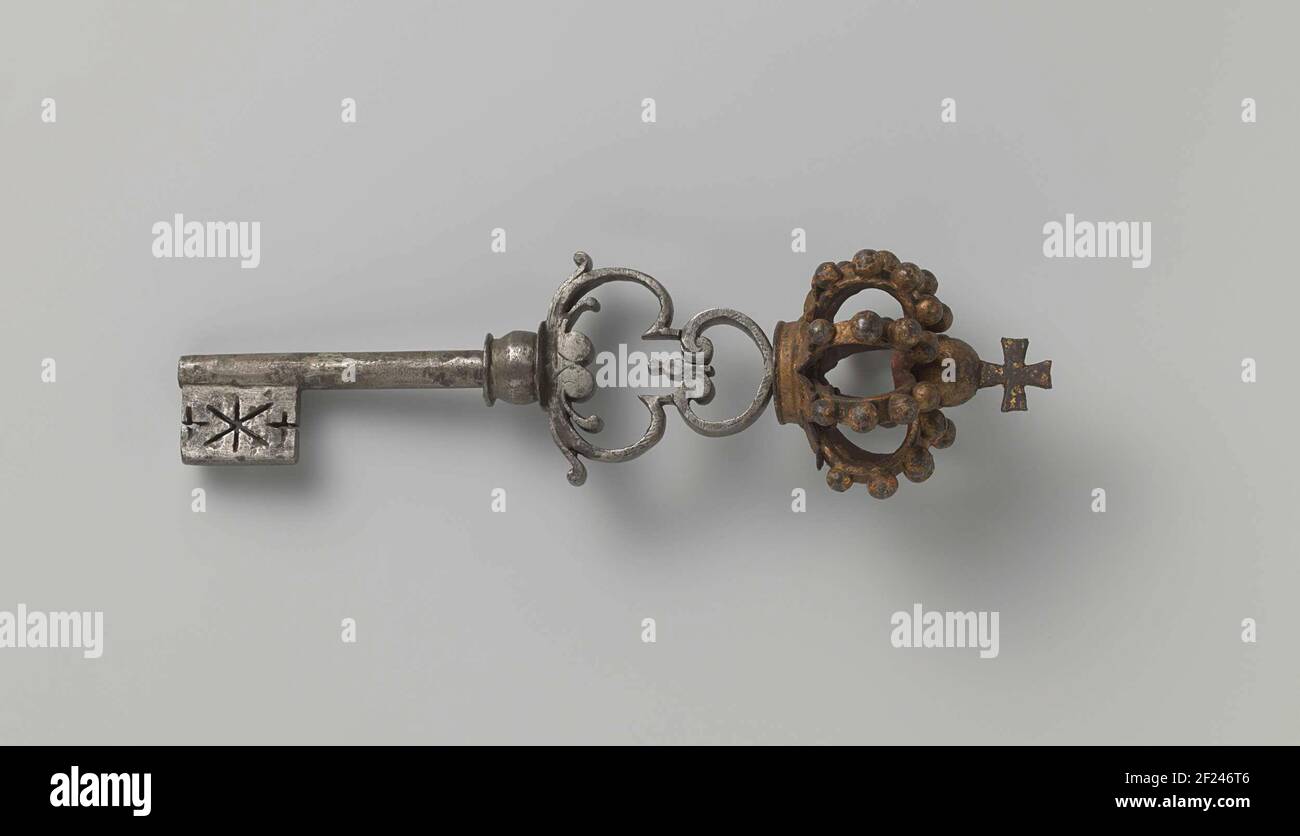 Iron key, on which a gold-plated crown Stock Photo - Alamy