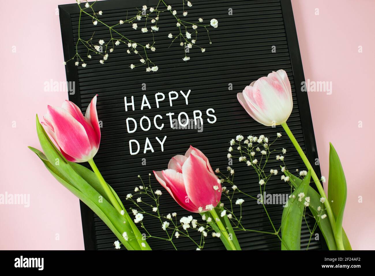 Black letterboard with white plastic letters with quote Happy Doctor's ...
