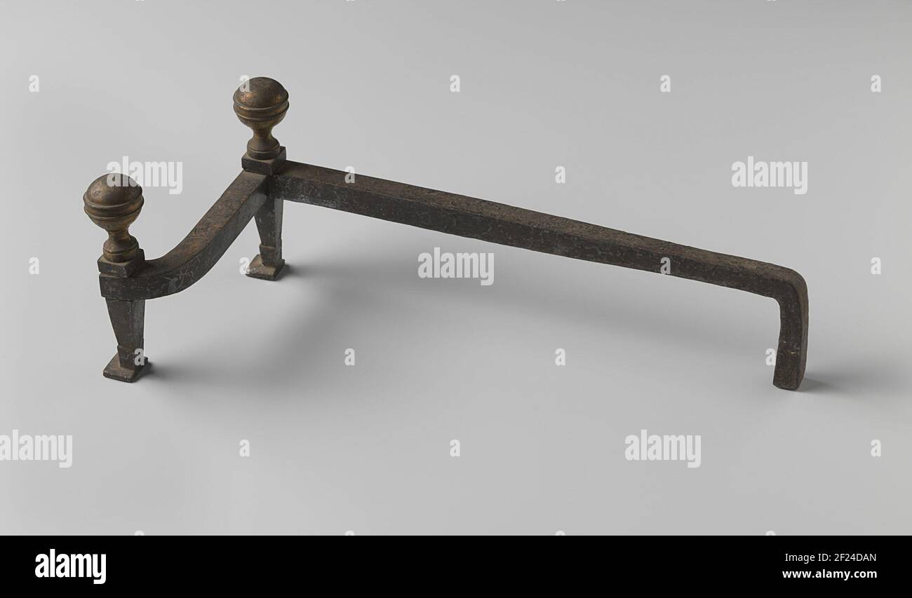 Fire iron with copper buttons Stock Photo - Alamy