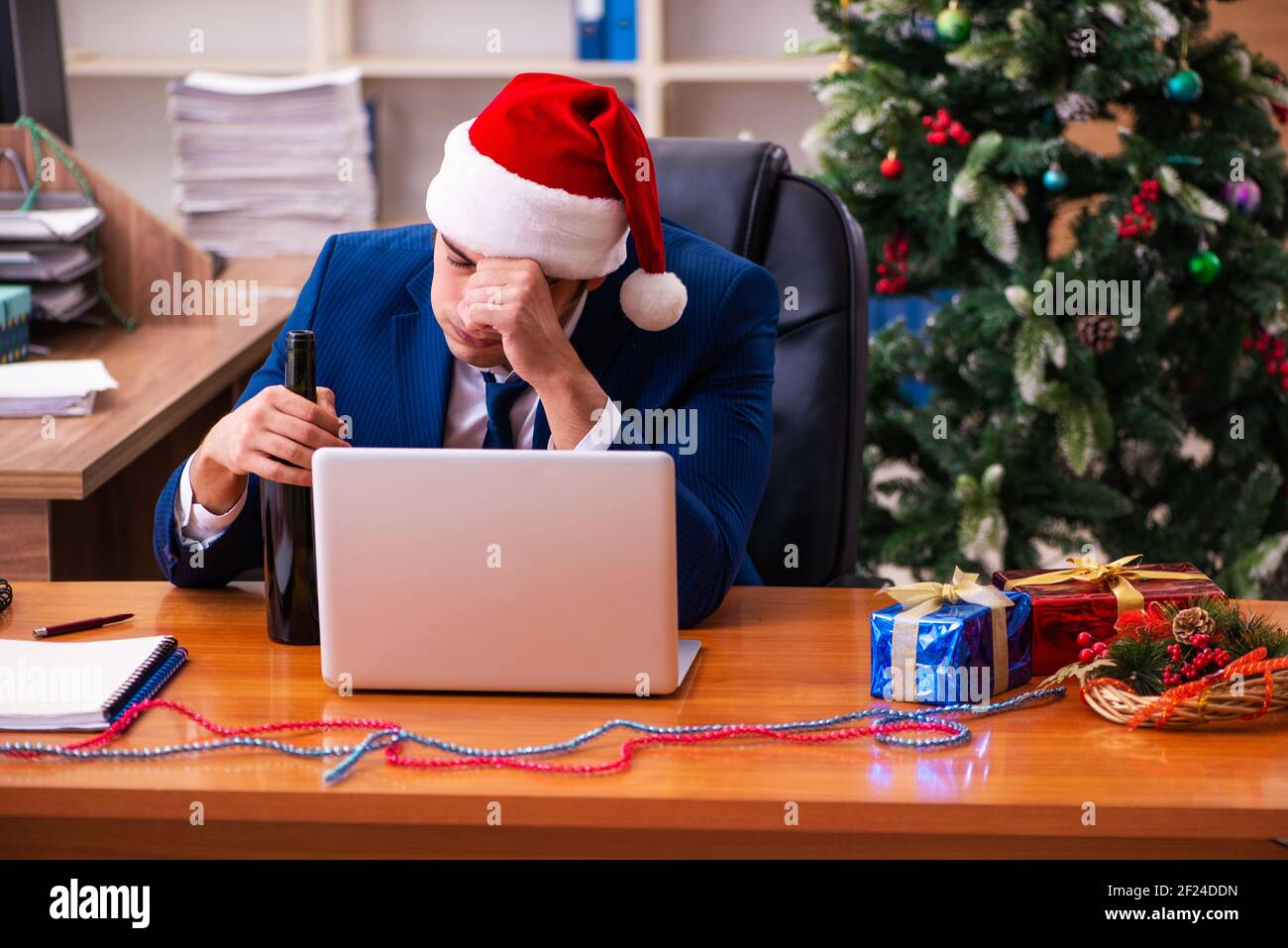 Employee in the office during christmas party Stock Photo - Alamy