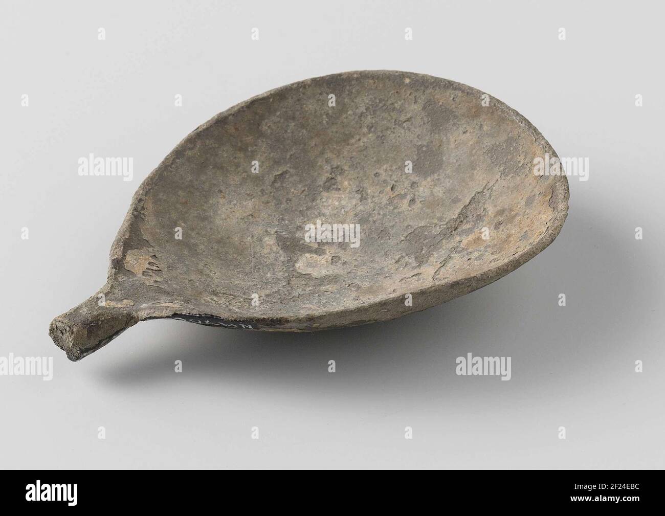 Spoon with oval bin and a straight stem with a diamond-shaped cross ...