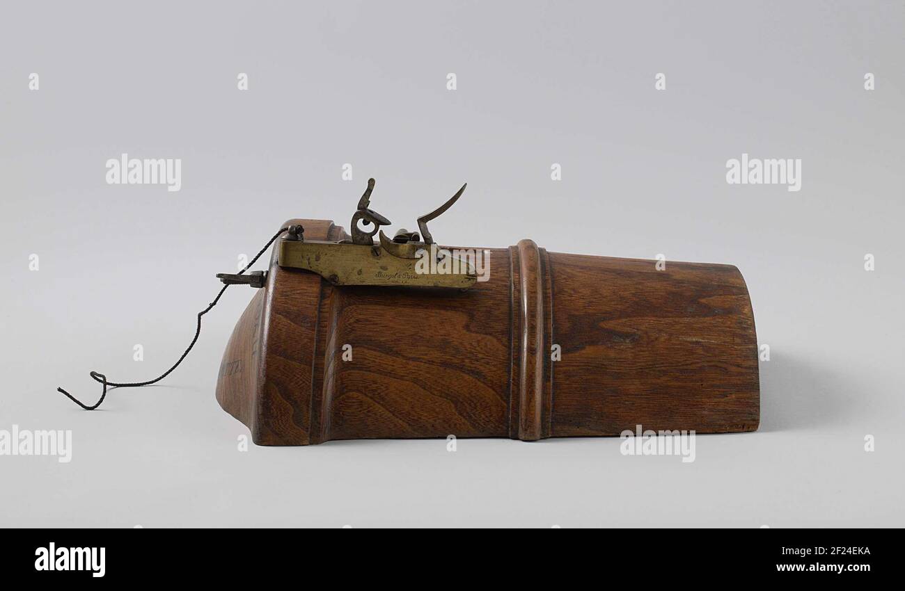 Flint gunlock for a 12-pounder cannon on a wooden breech.Cannon were ...
