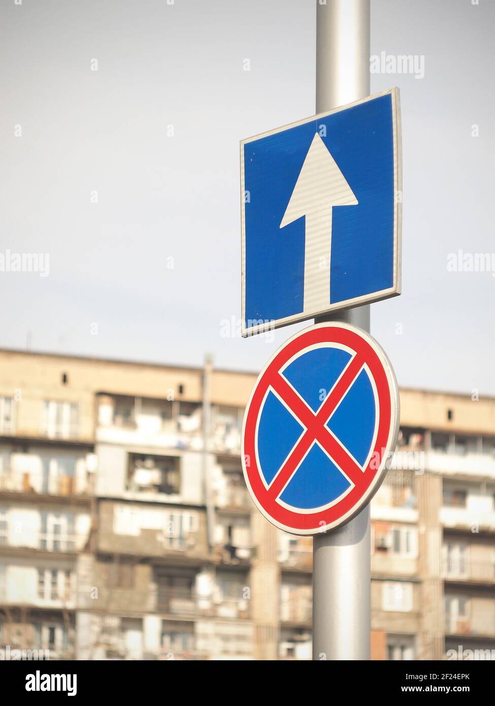 Road signs with a multistory building background Stock Photo - Alamy