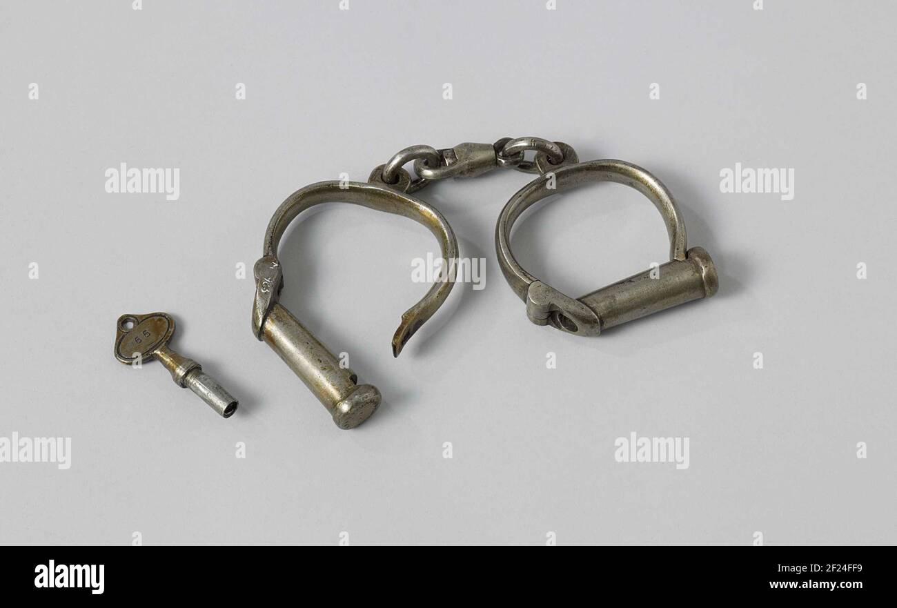 Pair or handcuffs. A few iron handcuffs, with a few links together, and ...