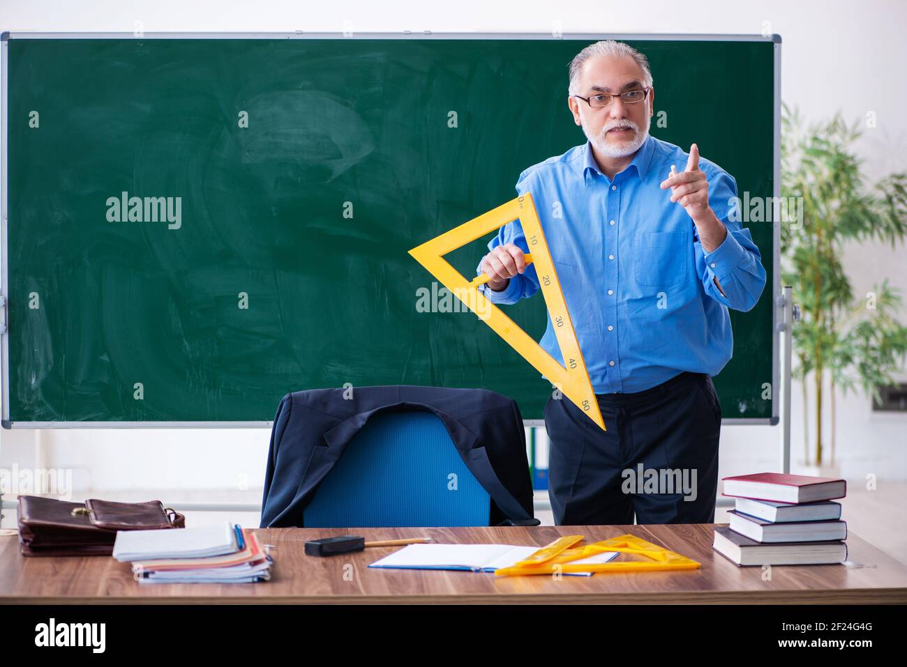 Old school teacher ruler hi-res stock photography and images - Alamy