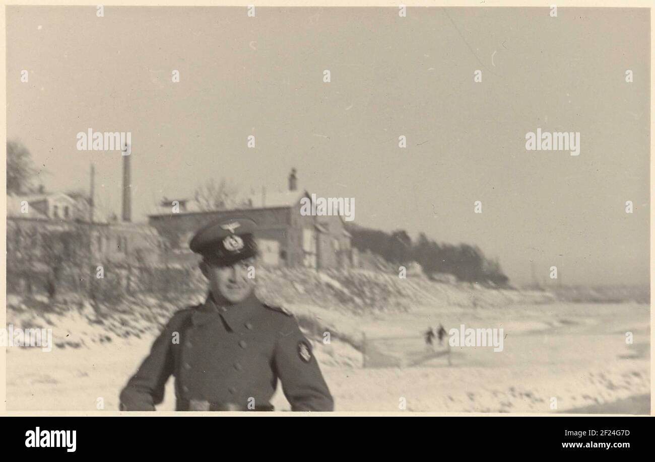 German soldier at a riverside in the snow. A German soldier at a ...