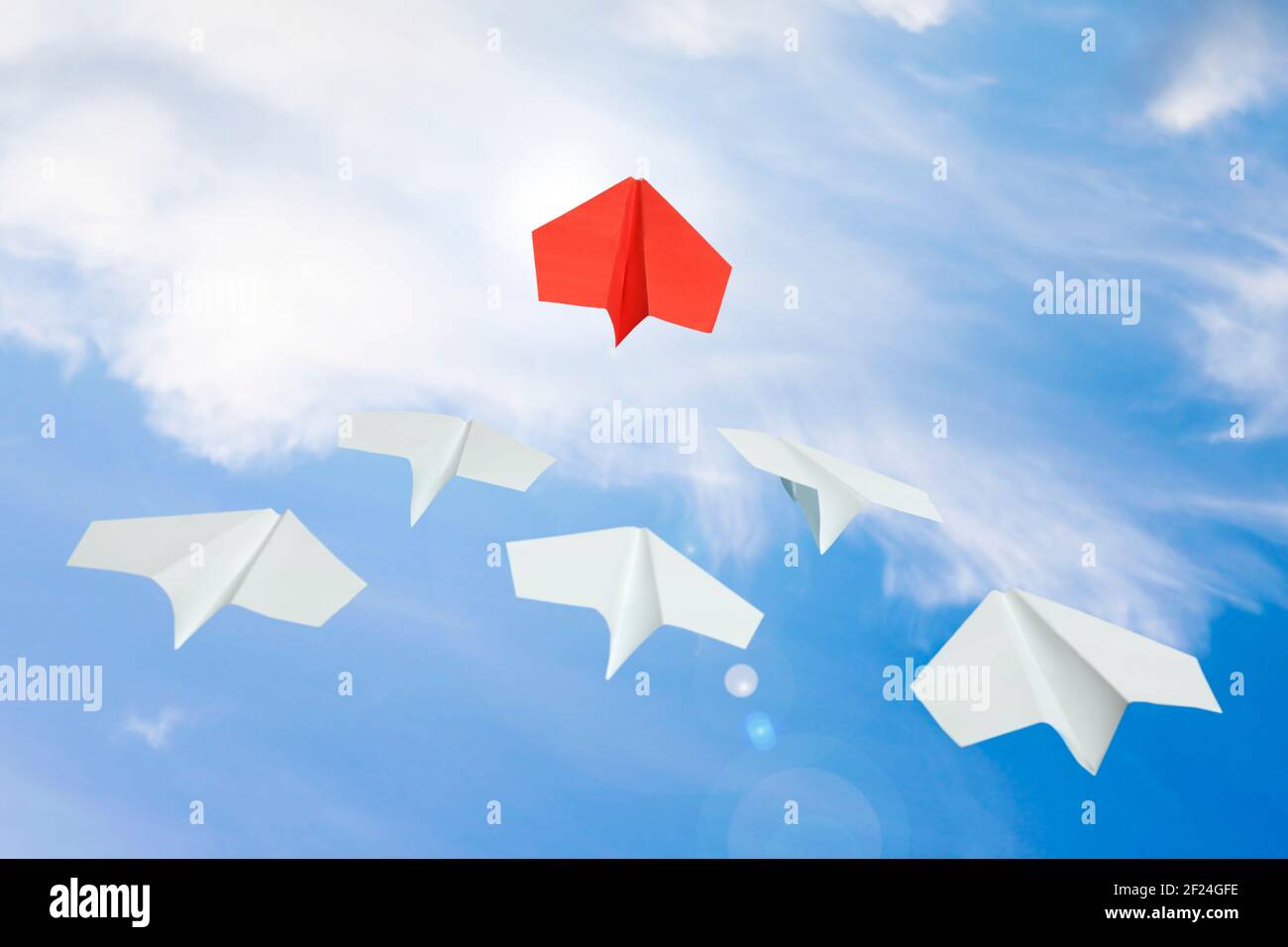 red paper plane leading others in bright sky, leadership concept Stock ...