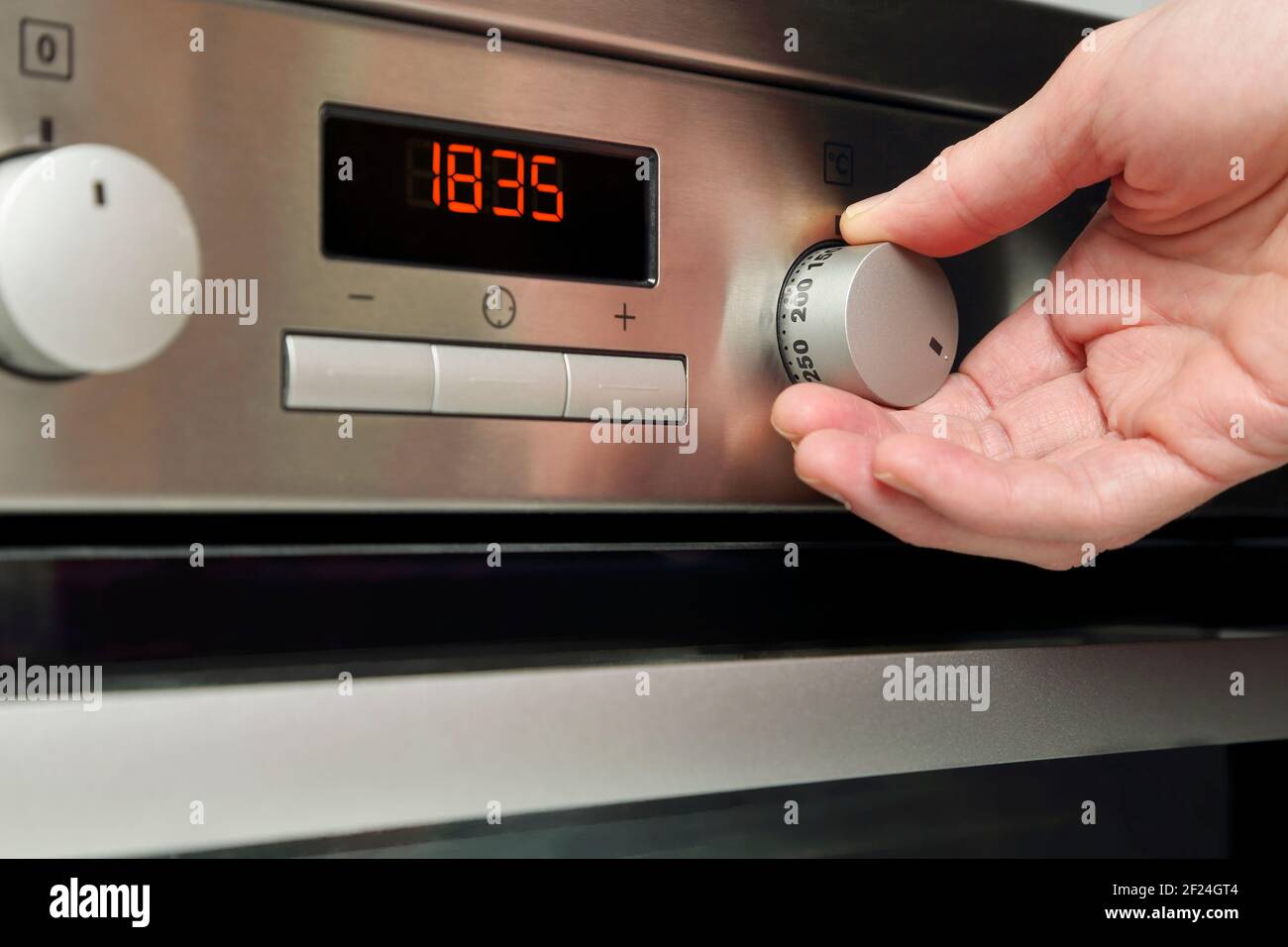 Temperature control oven hand hi-res stock photography and images - Alamy