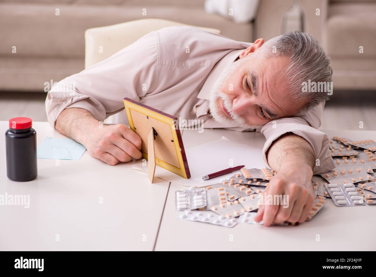 Old sick man suffering at home Stock Photo - Alamy