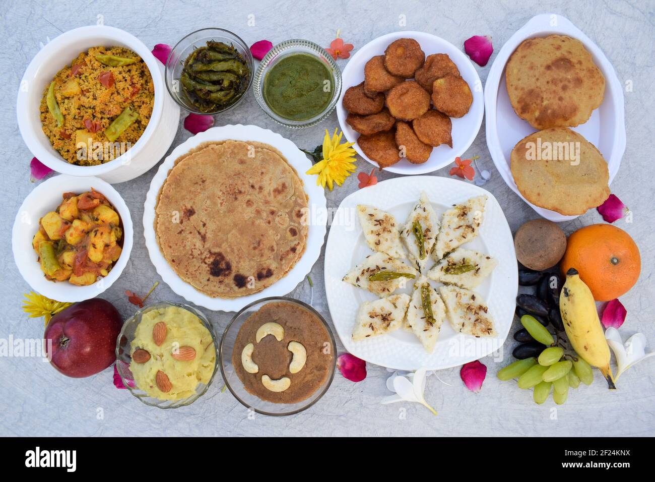 Farali vrat thaali homemade items Rajgira sheera, paratha, puri bhajiya ...