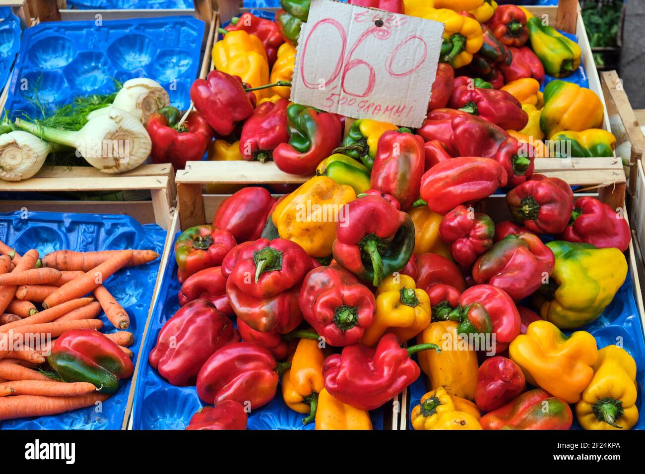 Red and yellow bell pepper for sale at a market Stock Photo - Alamy