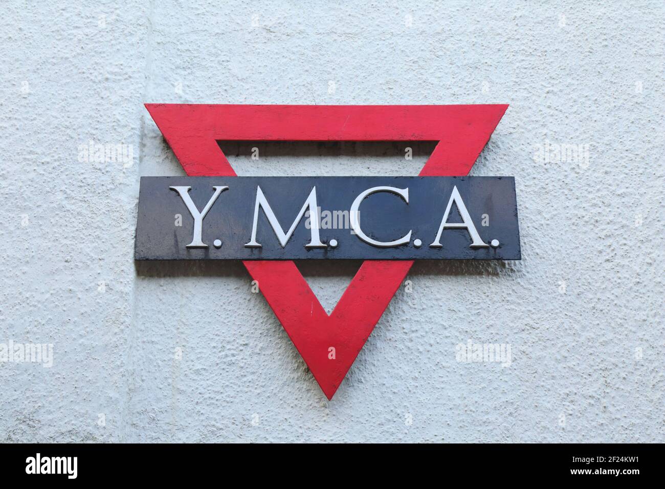 YMCA (Young Men's Christian Association) sign on the white wall in town ...