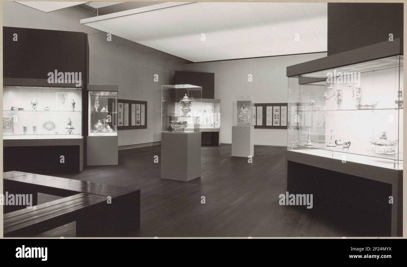 Room with silverware in showcases, fronts are benches in a square ...