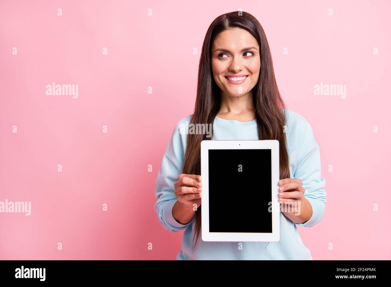 Photo portrait of dreamy woman showing tablet screen with copyspace ...