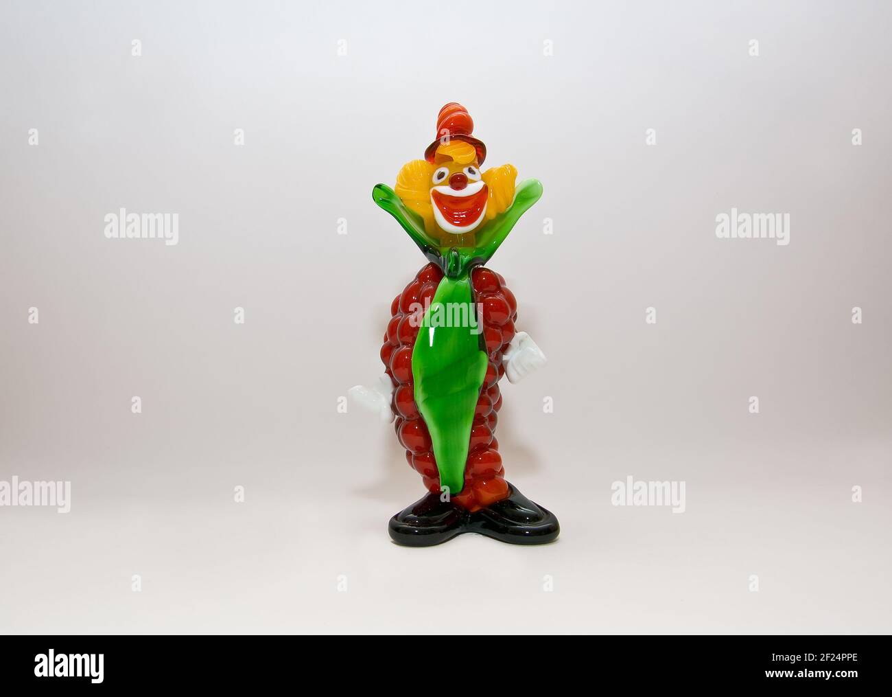Figurine of the cheerful red clown from glass with a body in the form ...