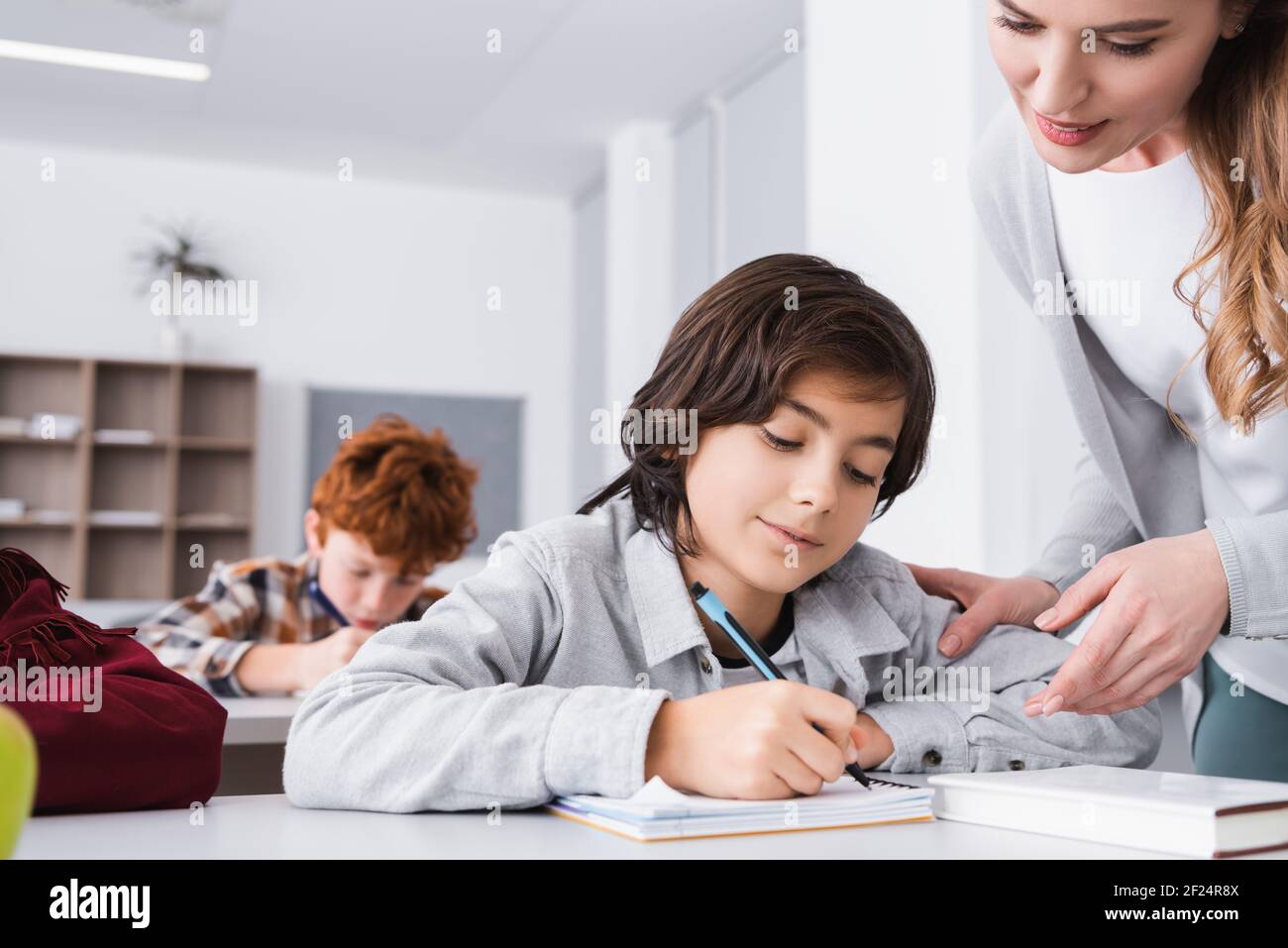 Helping kids learn to write hi-res stock photography and images - Alamy