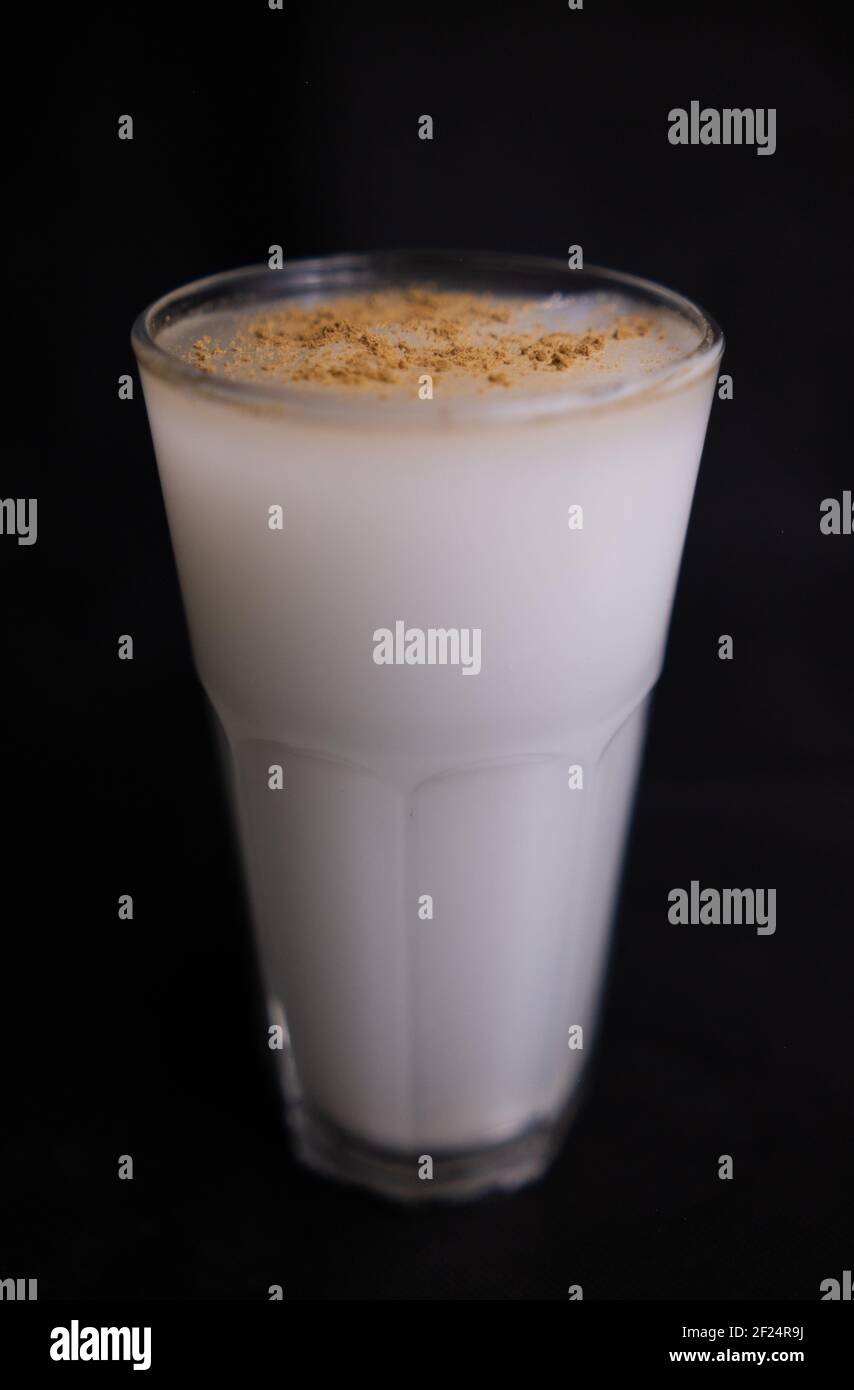 Glass of traditional Mexican horchata water with black background Stock ...