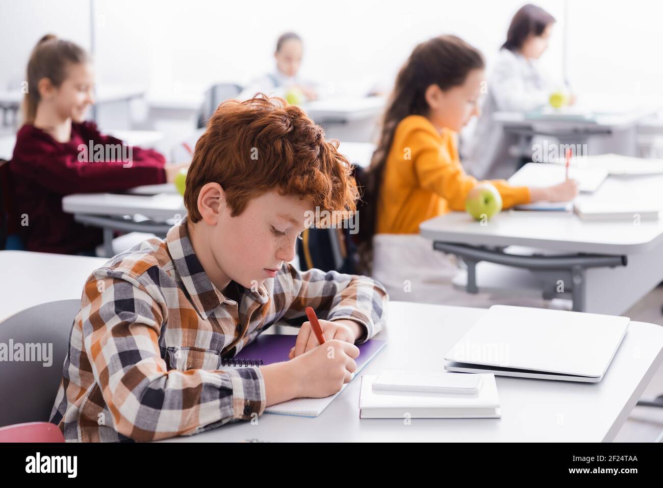 School kids on laptop in class hi-res stock photography and images - Alamy