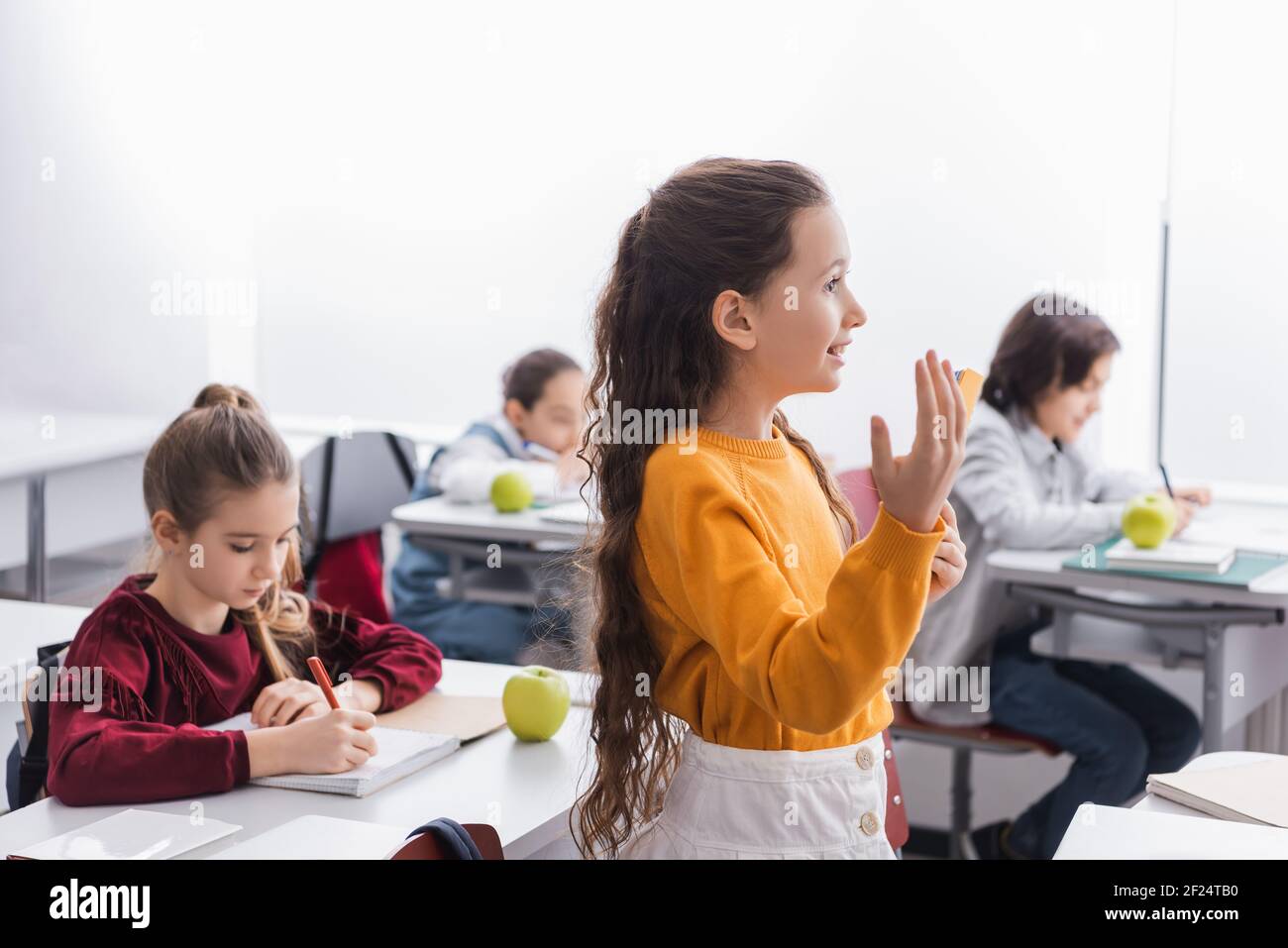 School girls talking hi-res stock photography and images - Alamy