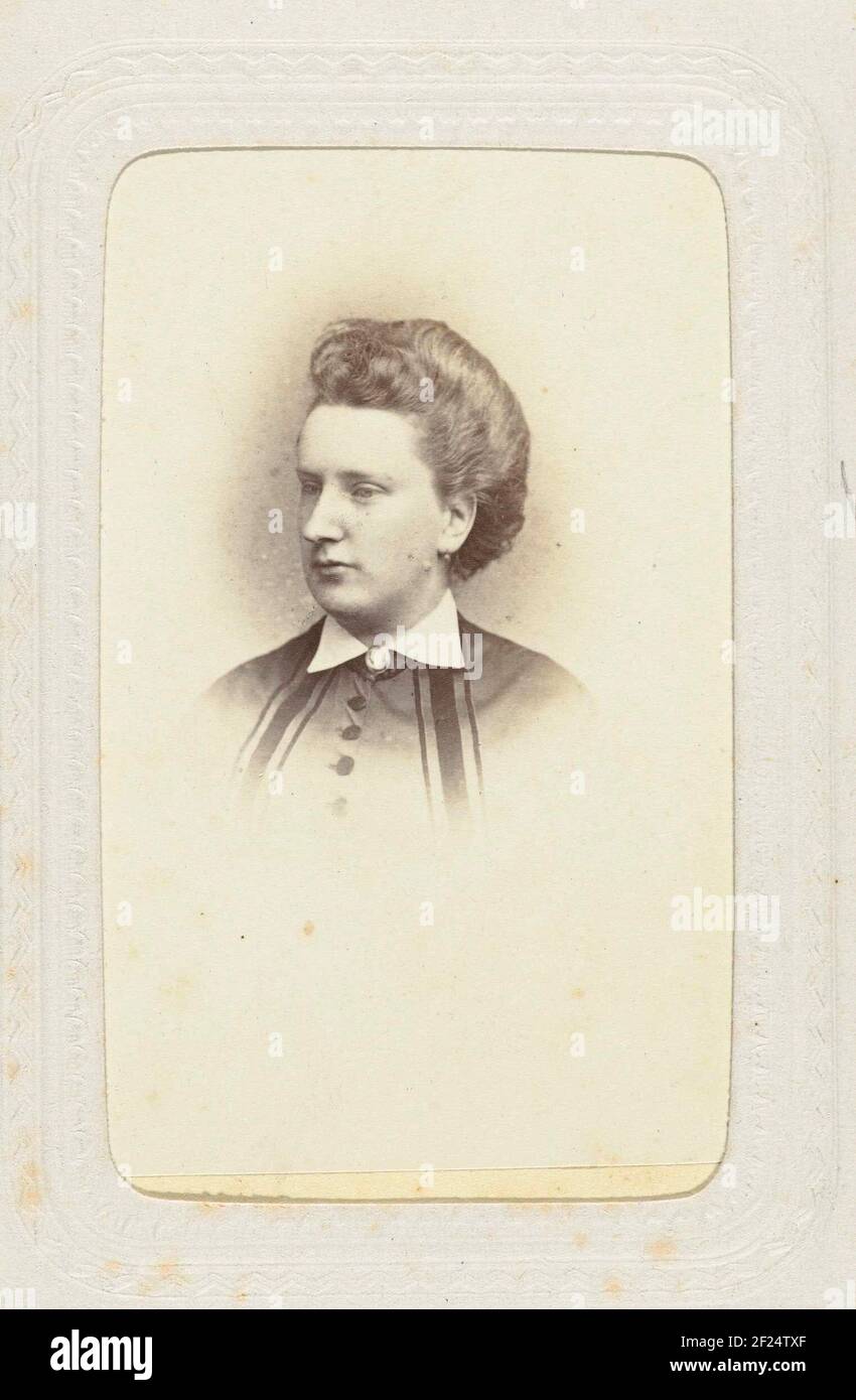 Studio portrait of a woman with raised hair Stock Photo - Alamy