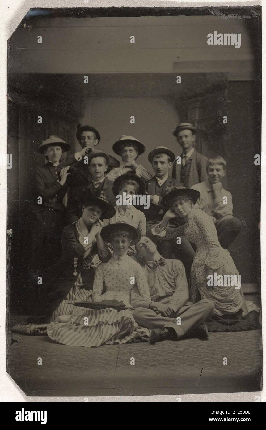 Group portrait of six men and six women, standing and sitting in front ...