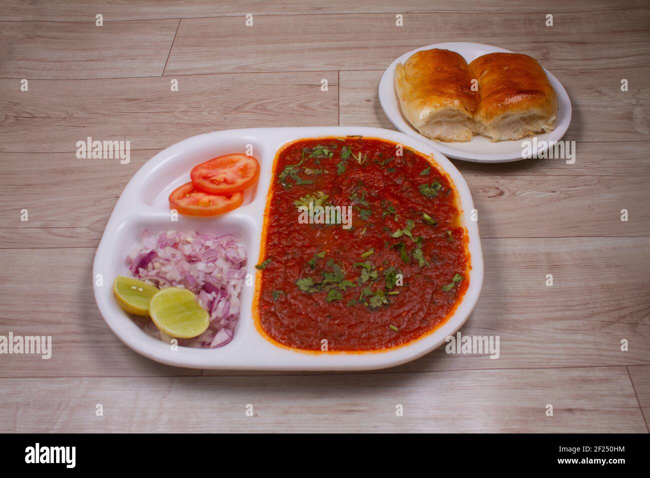 Pav Bhaji is a fast food dish from India, thick and spicy vegetable ...