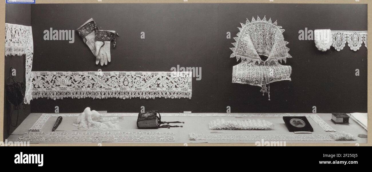 Showcase with various objects including a collar, a book and a few ...