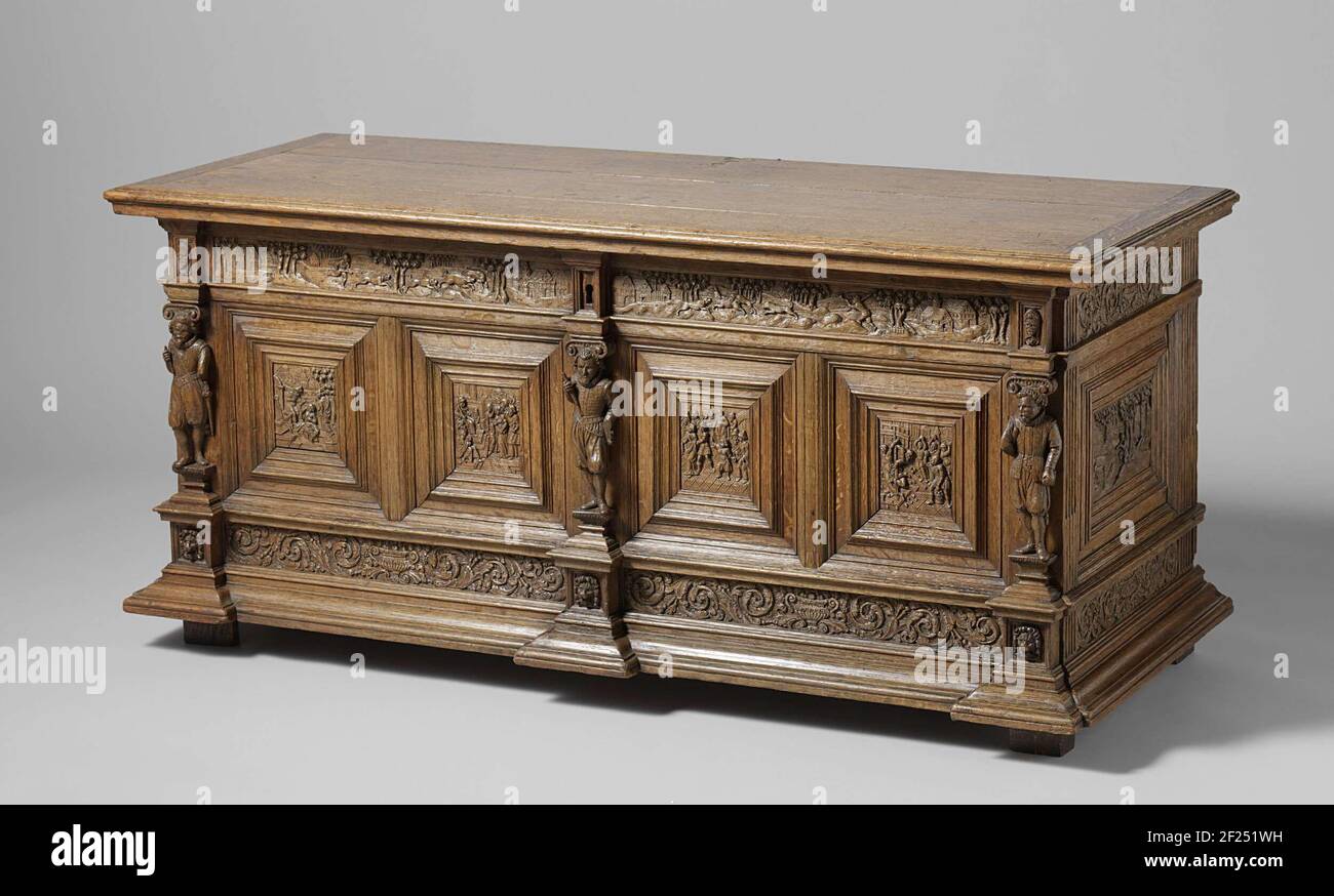 This storage chest is richly ornamented: the three carved statues on ...