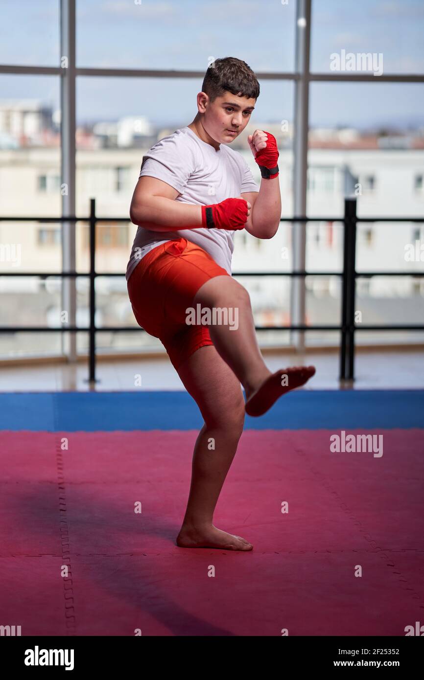 Overweight young kickboxer shadow boxing in the gym Stock Photo - Alamy