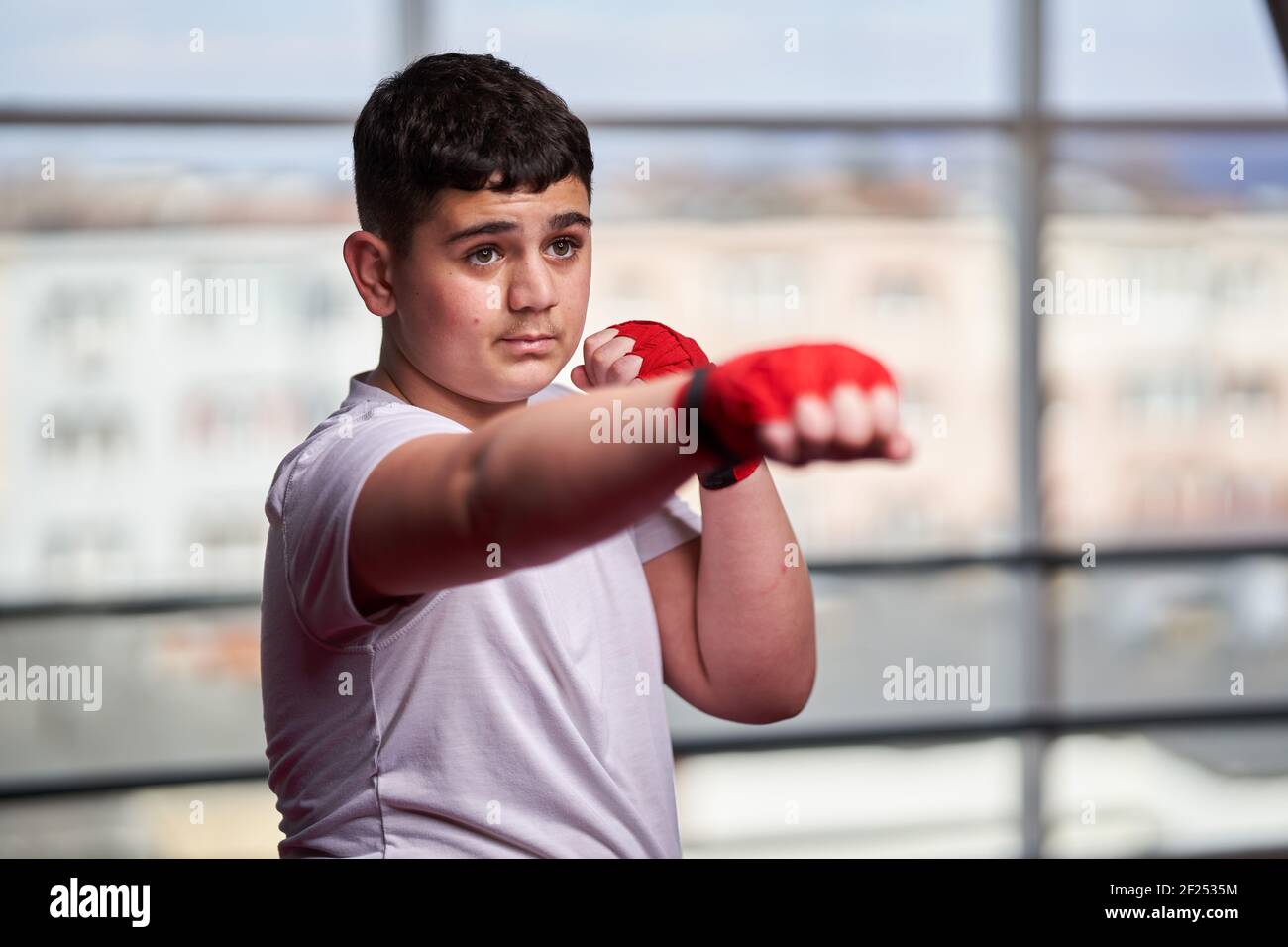 Overweight young kickboxer shadow boxing in the gym Stock Photo - Alamy