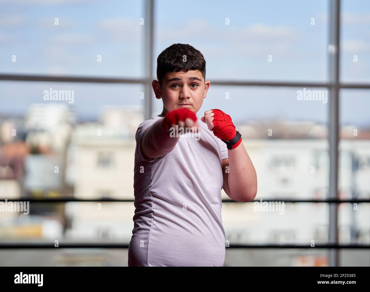 Overweight young kickboxer shadow boxing in the gym Stock Photo - Alamy