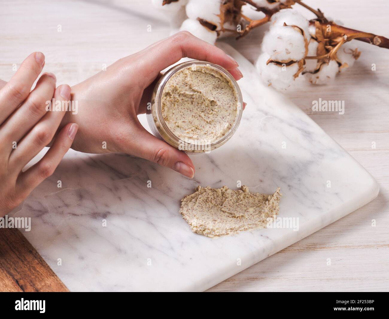 Natural body scrub on marble background. Cosmetic face cream container ...