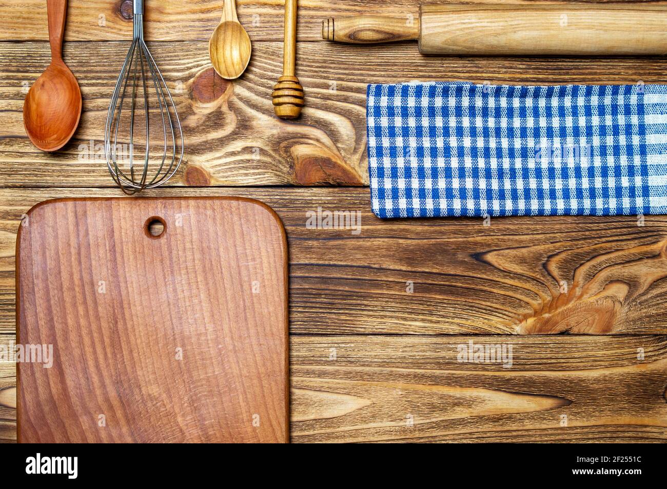 Kitchen utensils (cooking tools) on a wooden background (top view, flat ...