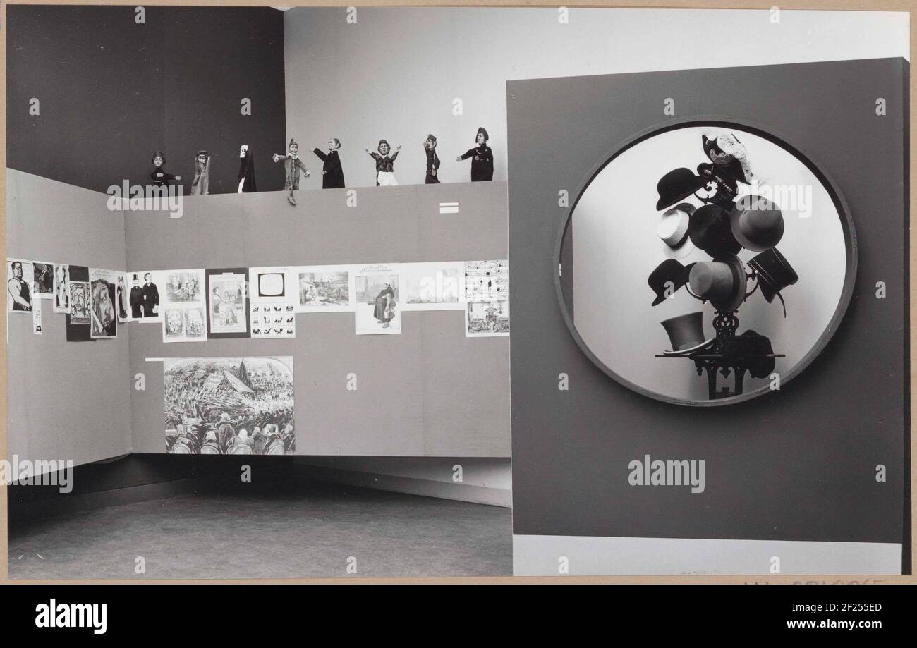 Corner of a hall with puppet dolls, cartoon and headwear; Living and ...