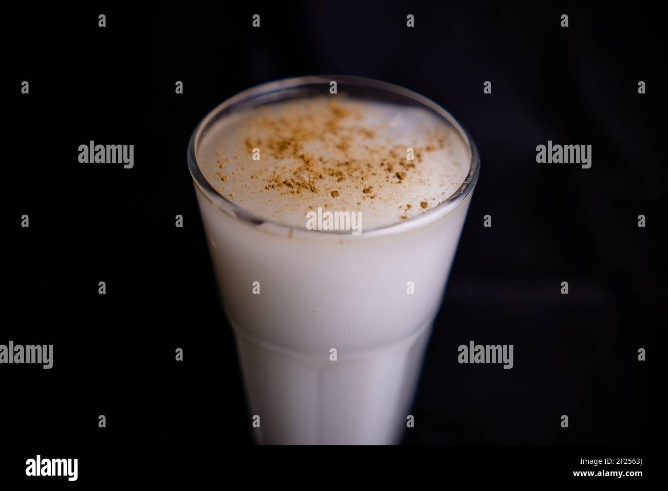 Glass of traditional Mexican horchata water with black background Stock ...