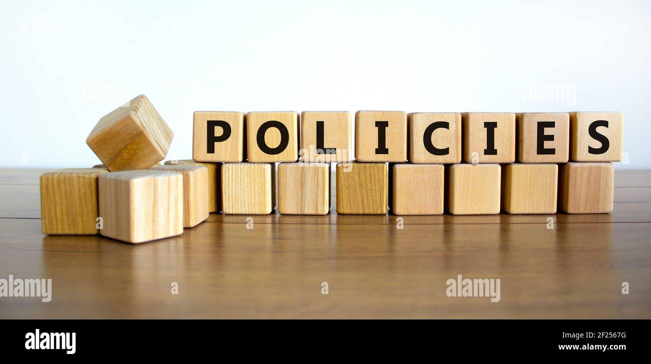 Policies symbol. Concept word 'policies' on wooden cubes on a beautiful ...