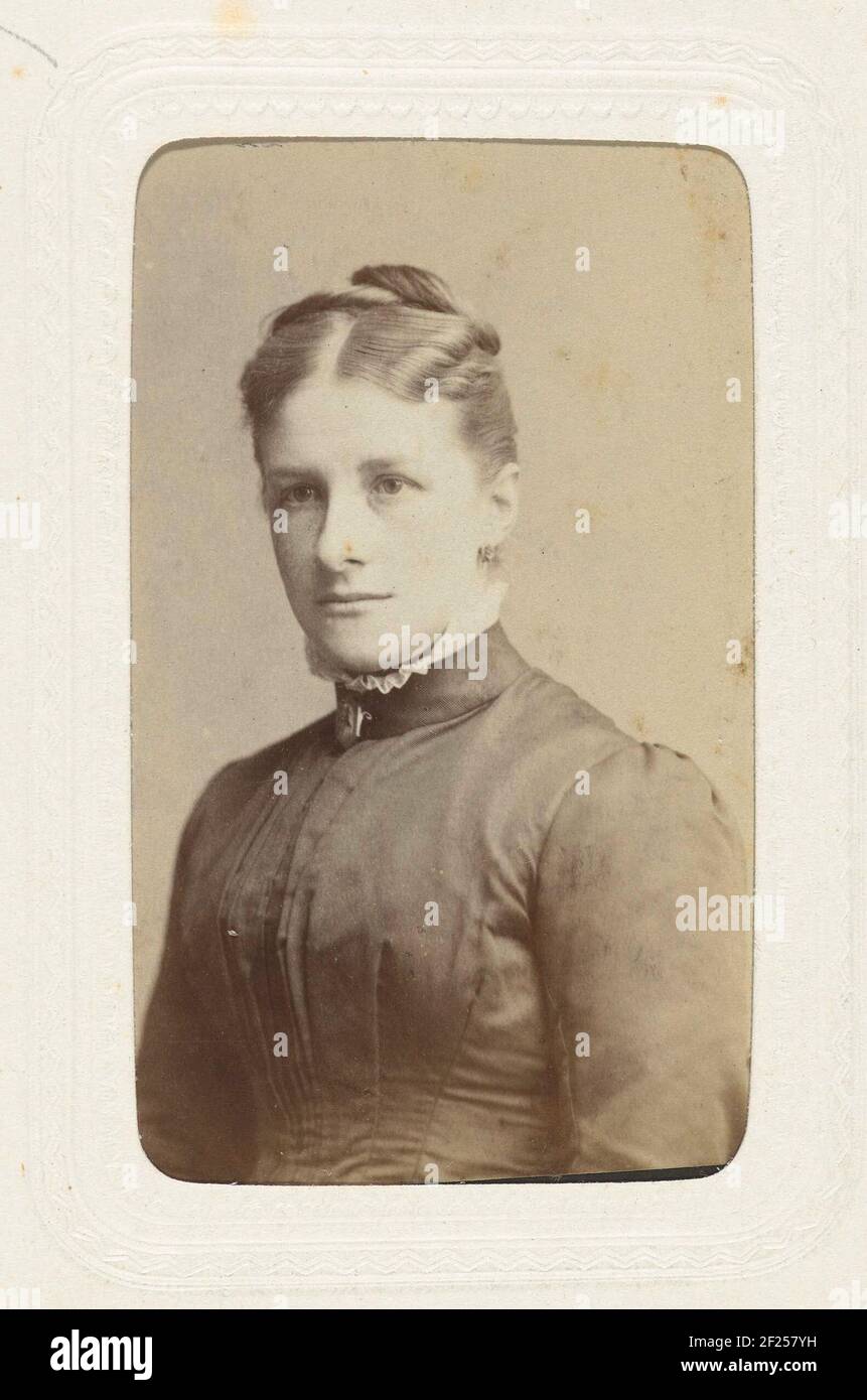 Studio portrait of a woman with raised hair Stock Photo - Alamy