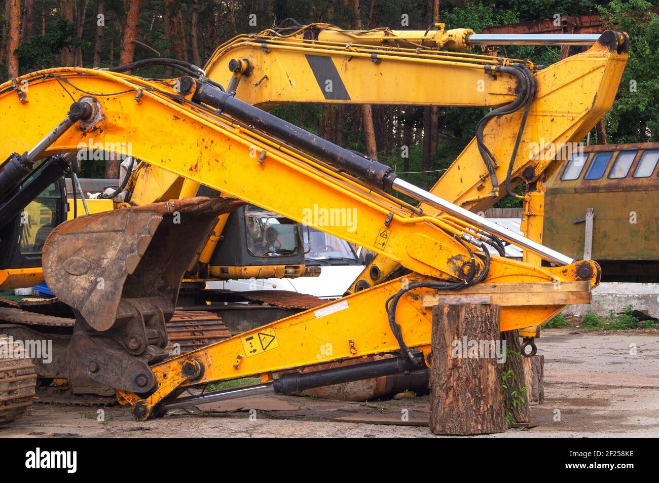 old broken excavator is being repaired. Rusty metal, remnants of old ...