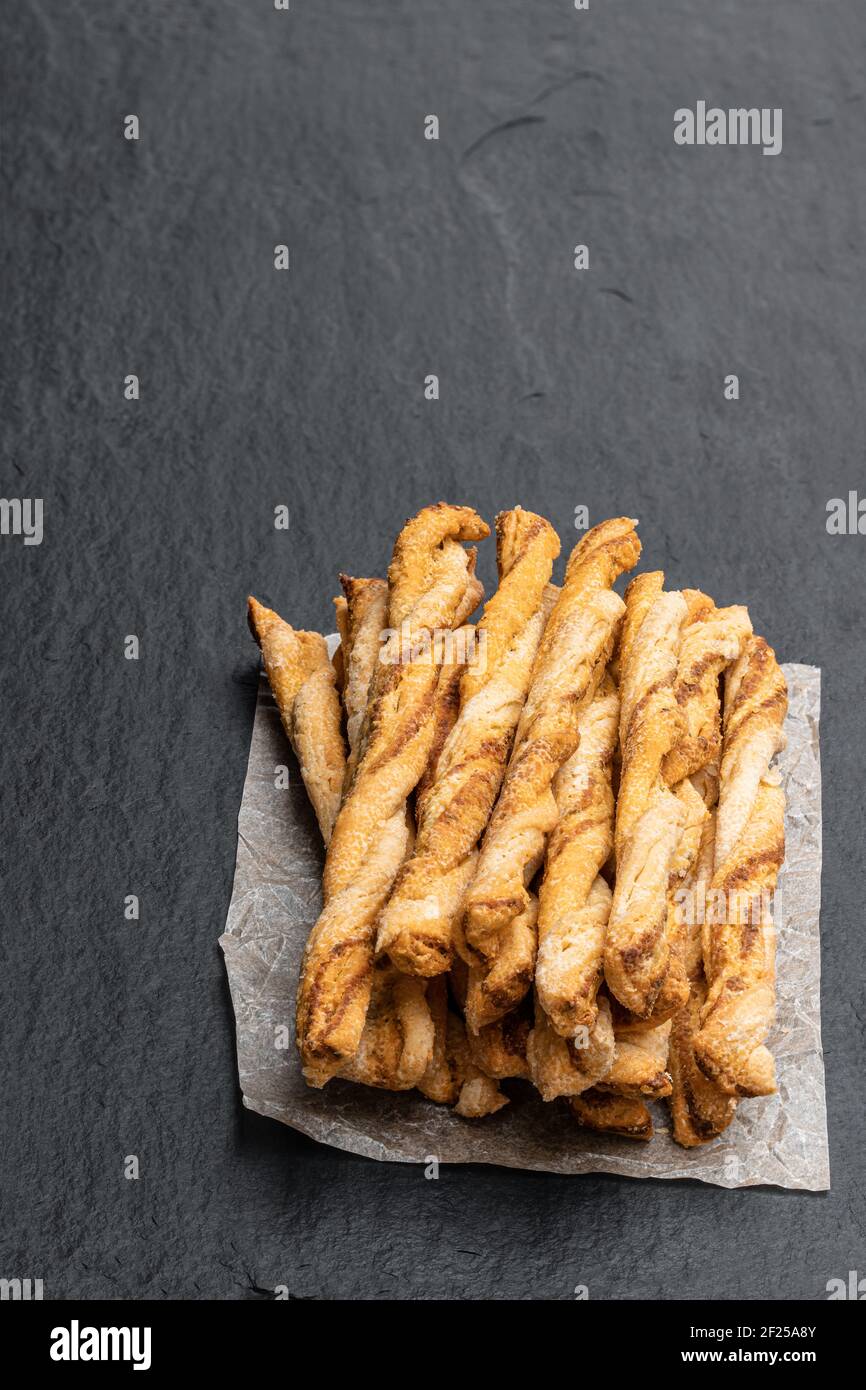 Spicy puff pastry twists isolated on white Stock Photo - Alamy