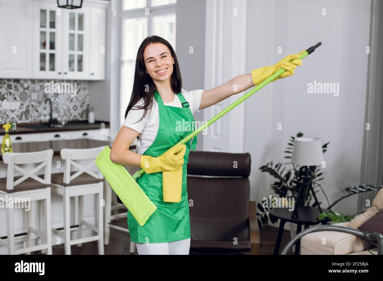 Cleaning woman dancing mop hi-res stock photography and images - Alamy