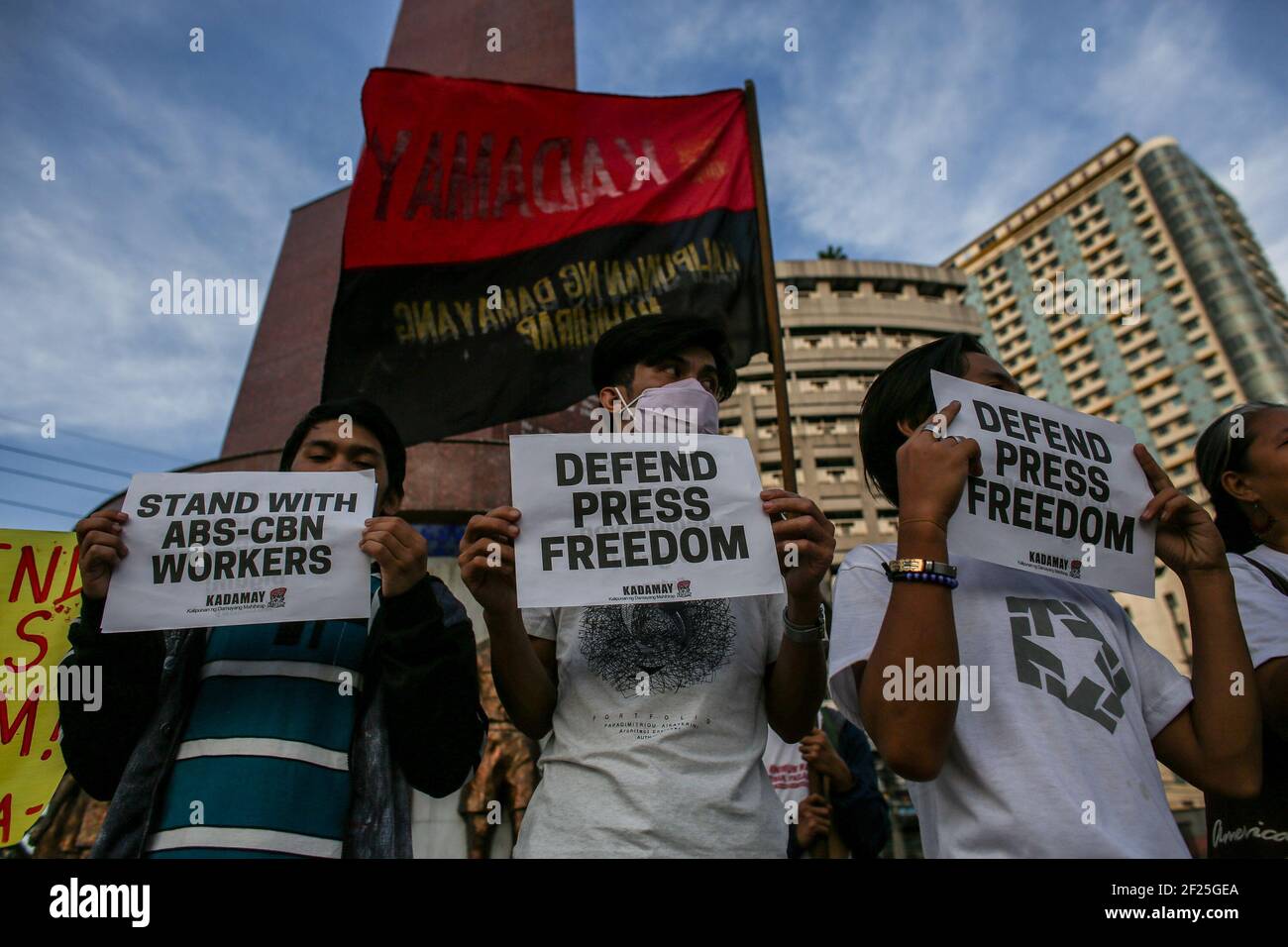 Protesters hold placards during a rally on press freedom following ...