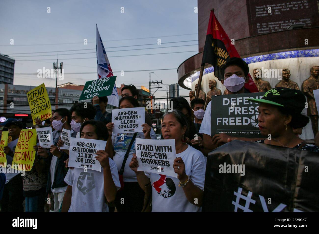 Protesters hold placards during a rally on press freedom following ...