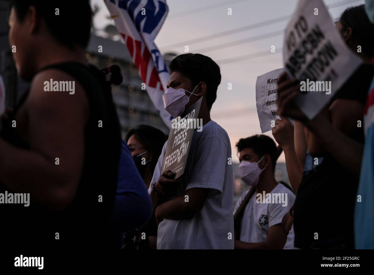 Protesters hold placards during a rally on press freedom following ...