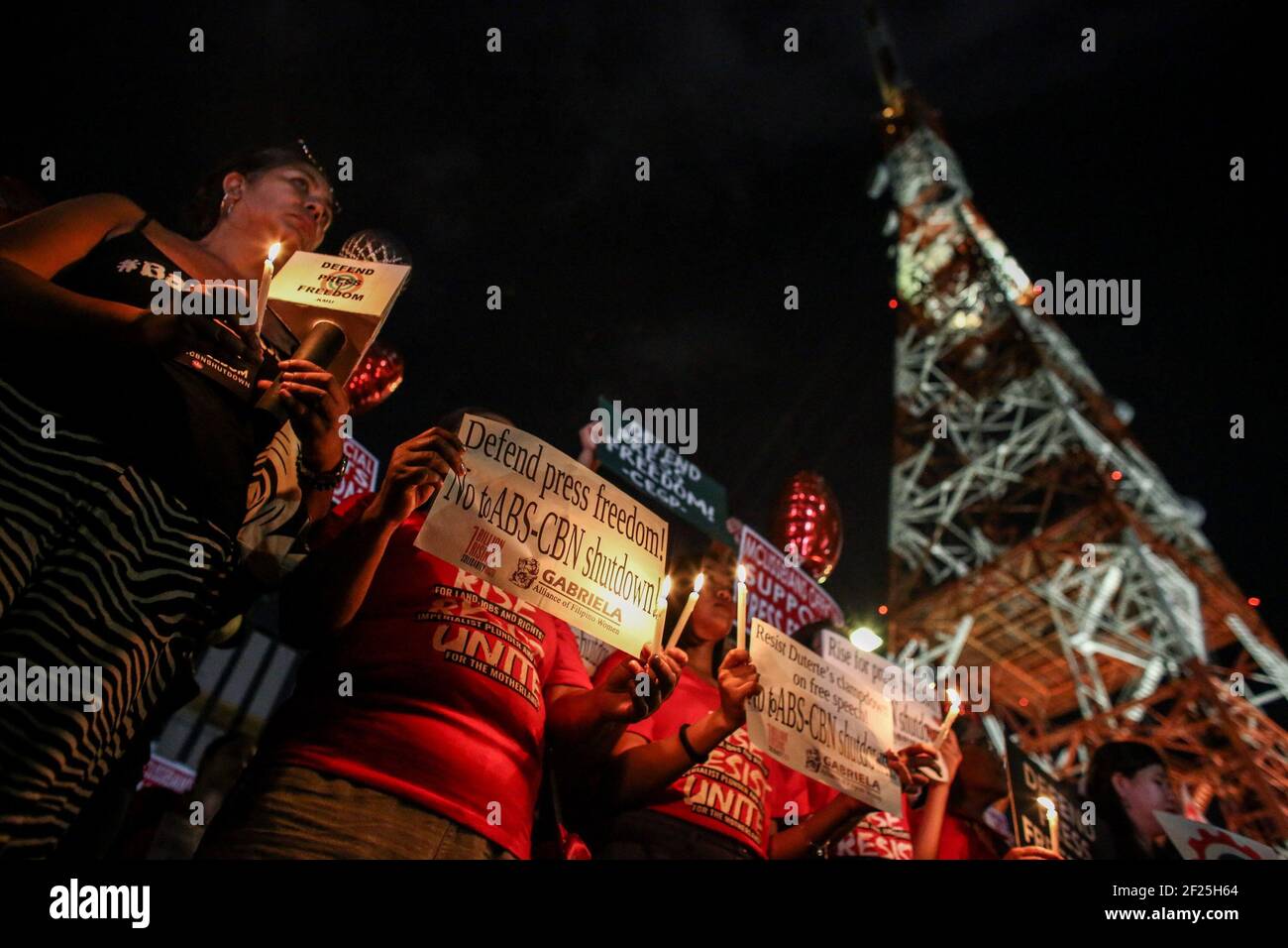 Protesters hold placards during a rally on press freedom following ...